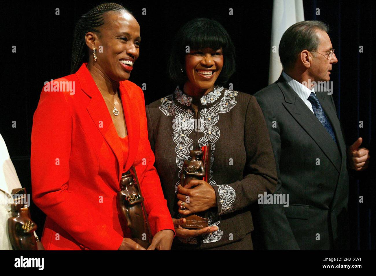Jamaican Prime Minister, Portia Simpson Miller, center, and Olympic ...