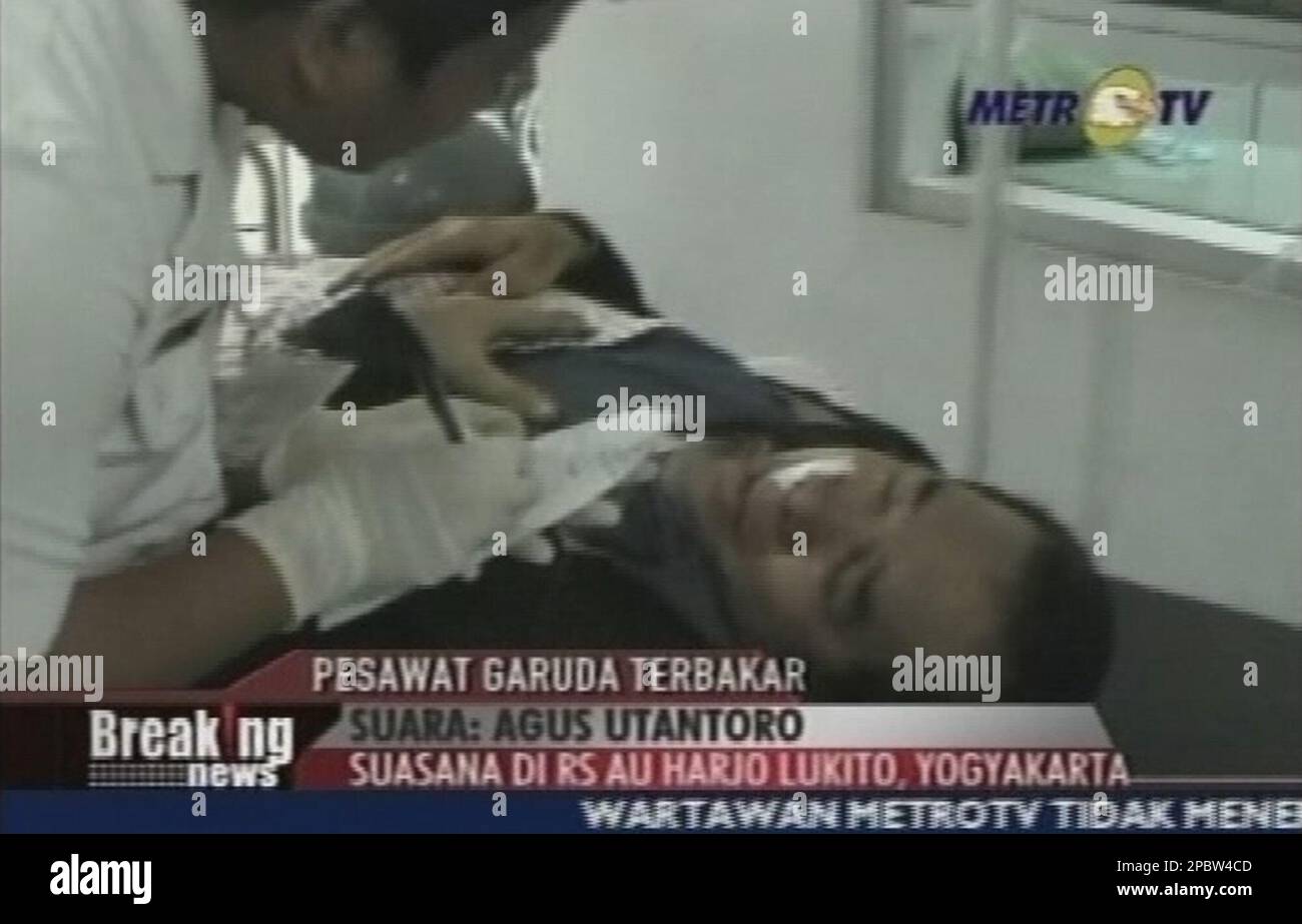 An injured passenger is seen at a hospital in Yogyakarta, Indonesia in this image taken from TV ...
