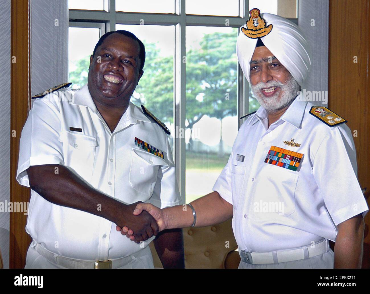 South Africa's Navy Chief Vice Admiral J.Mudimu, left, shakes hands ...