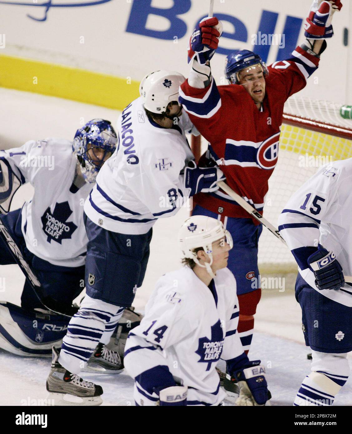 Montreal Canadiens' Christopher Higgins, center right, marks his assist ...
