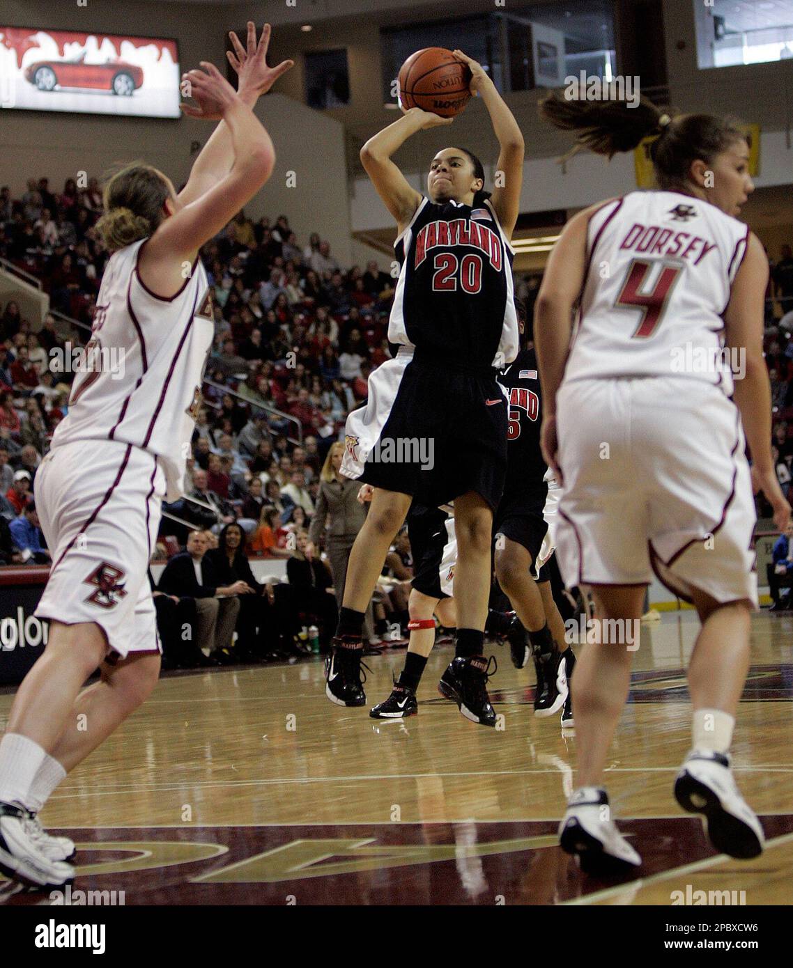 Maryland's Kristi Toliver, center, shoots over Boston College's Kathrin ...