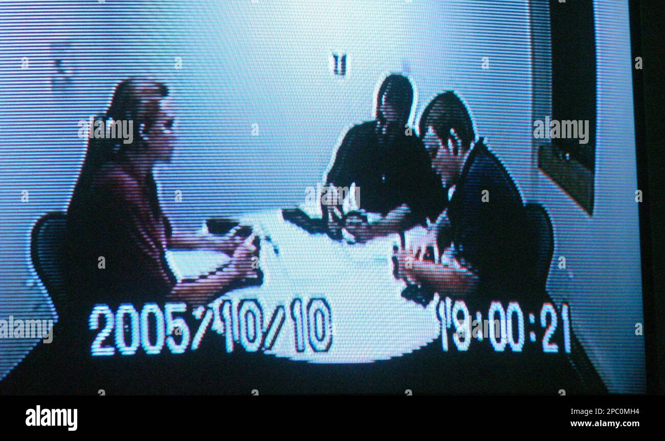 Jason Rose, left, is questioned by detectives in this 2005 video shown ...