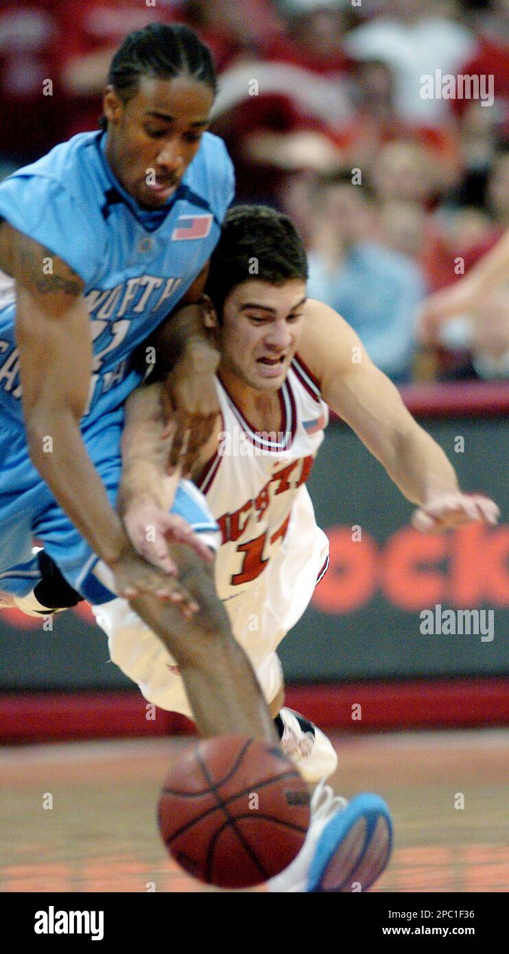 North Carolina's Quentin Thomas, left, battles North Carolina State's ...