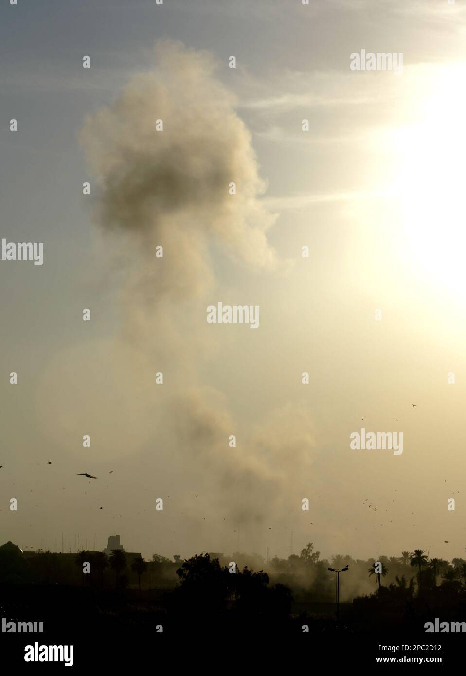 Smoke rises from the heavily fortified Green Zone, which houses the US ...