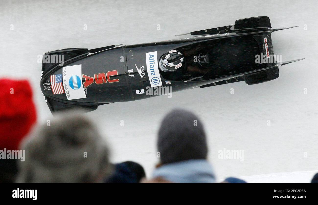Steven Holcomb and Brock Kreitzburg from the USA speed down the course ...