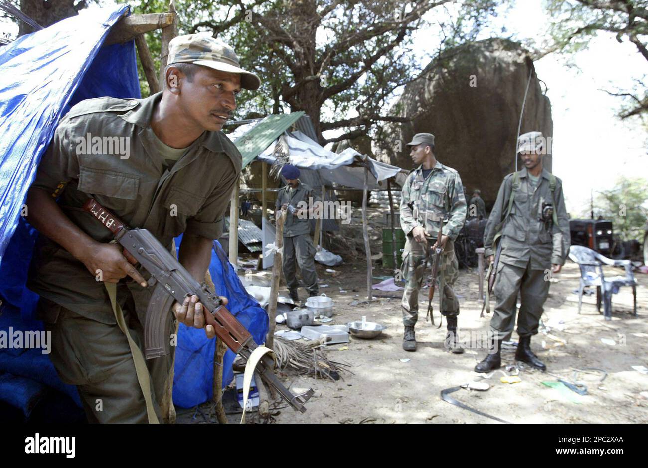 Sri Lankan Army soldiers inspect a Tamil Tiger base captured by the ...