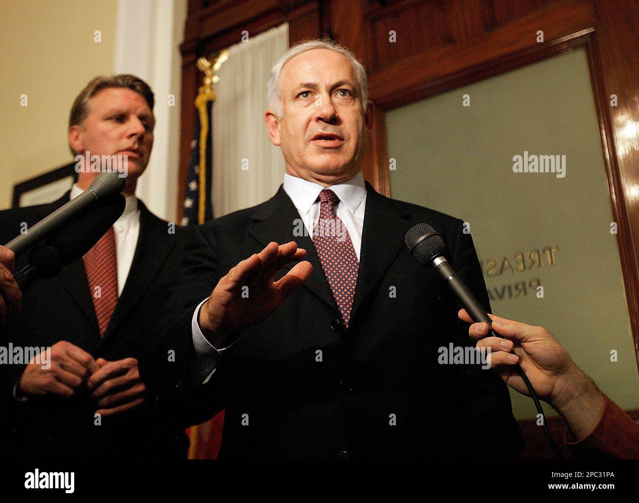 Former Israeli Prime Minister Benjamin Netanyahu, right, speaks to ...