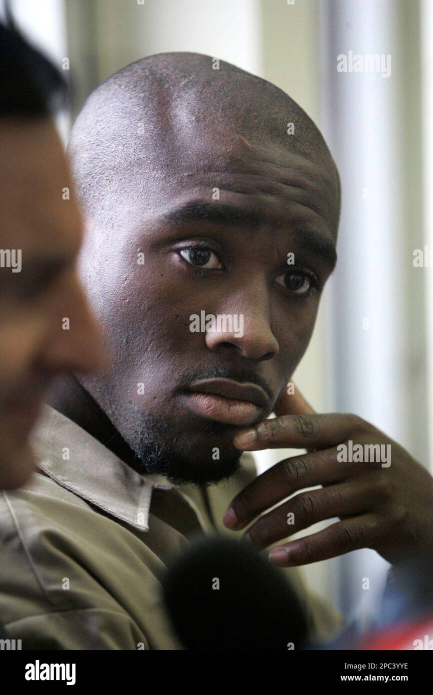 ** FILE ** Nathaniel Abraham stands as his attorney Daniel Bagdade ...