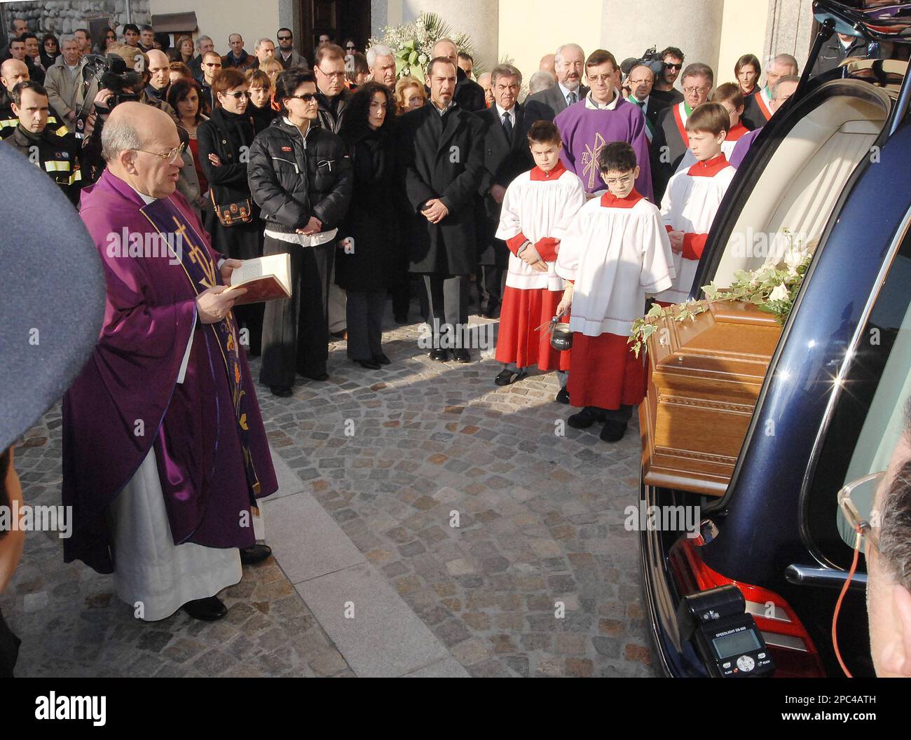 A priest prays during the funeral service of Valeria Cherubini in ...