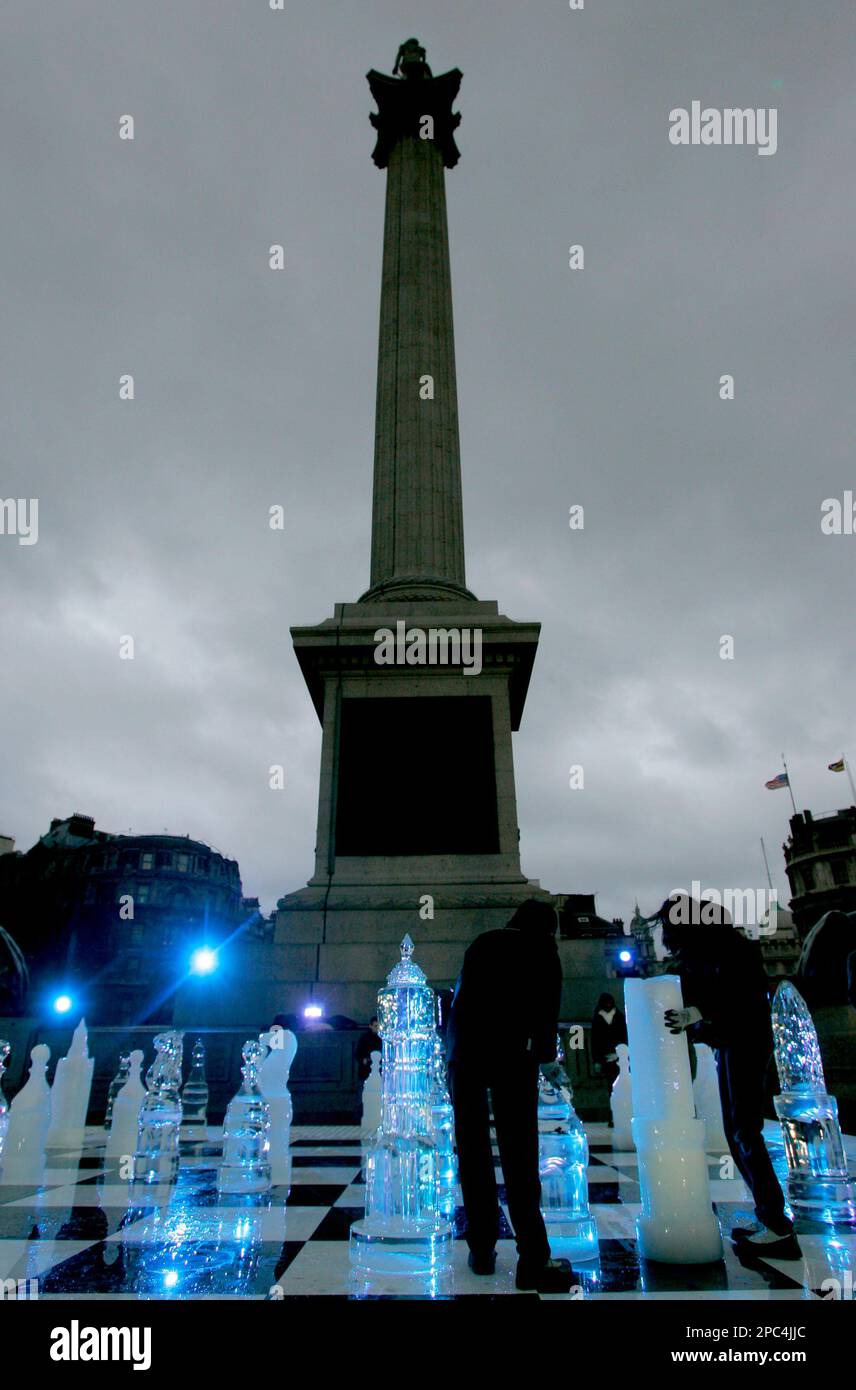 A giant ice chess piece is moved during the world's first international ...