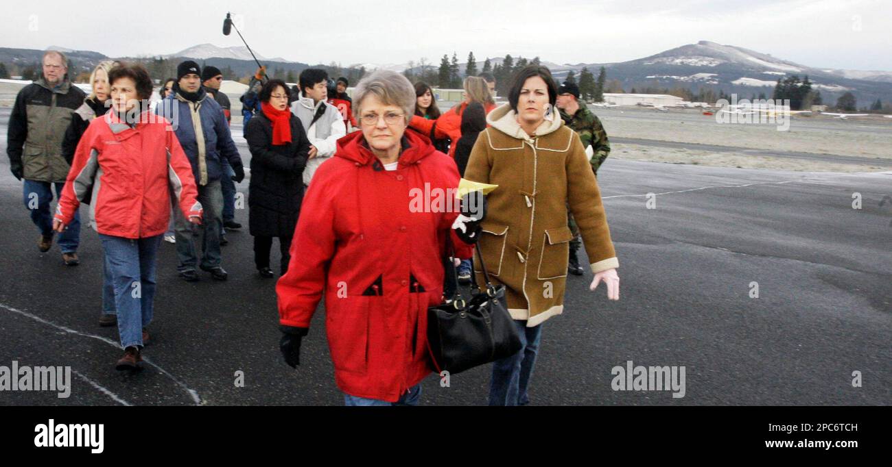 Brian Hall's mother, Clara Hall, left with pink jacket; mother of Jerry ...