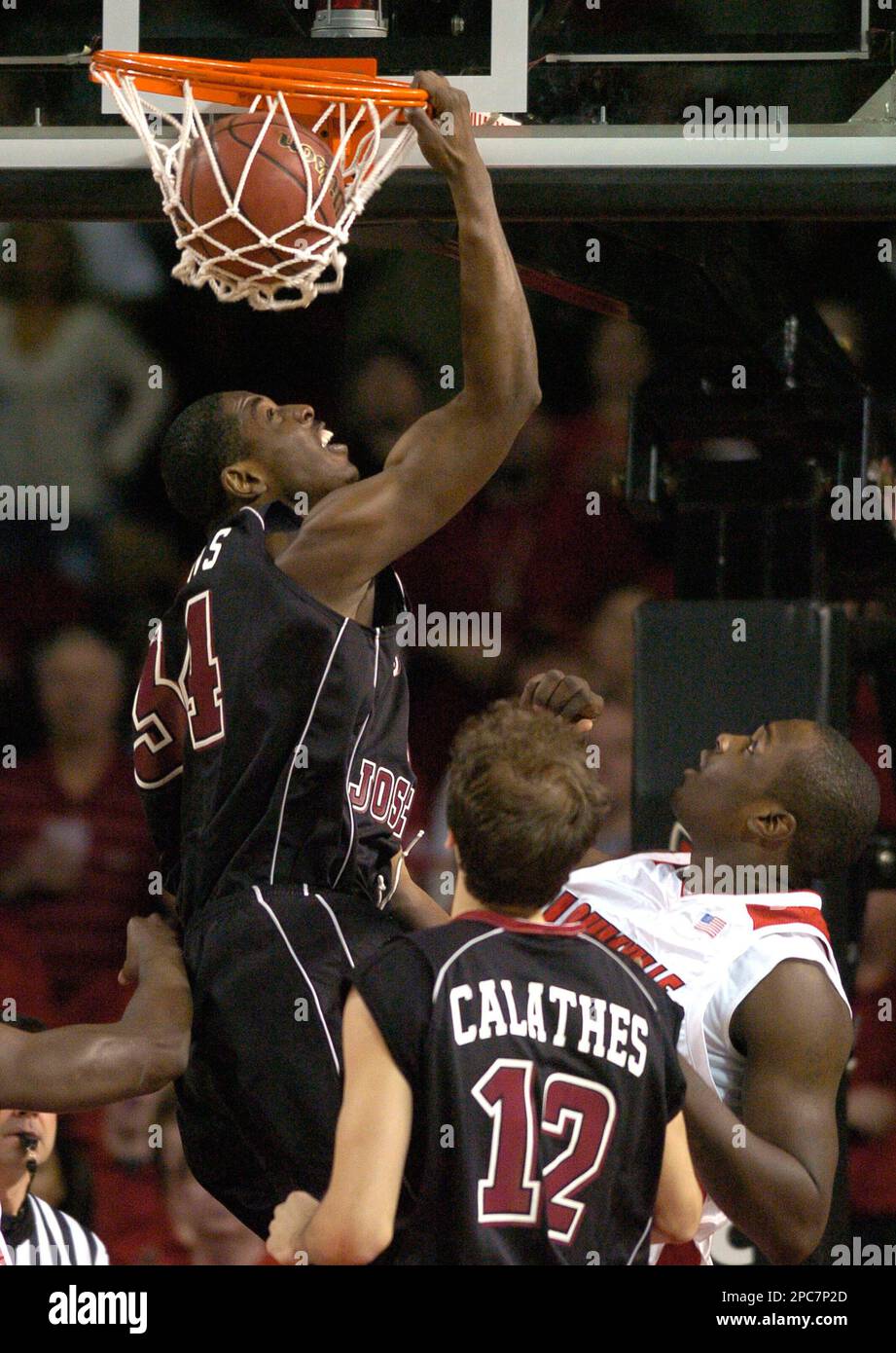 Saint Joseph's Ahmad Nivins dunks over Louisville's Derrick Caracter ...