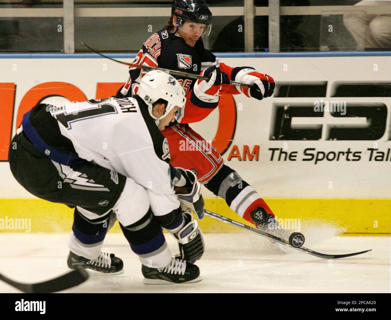 Tampa Bay Lightning Cory Sarich (21), left, and New York Rangers Petr ...