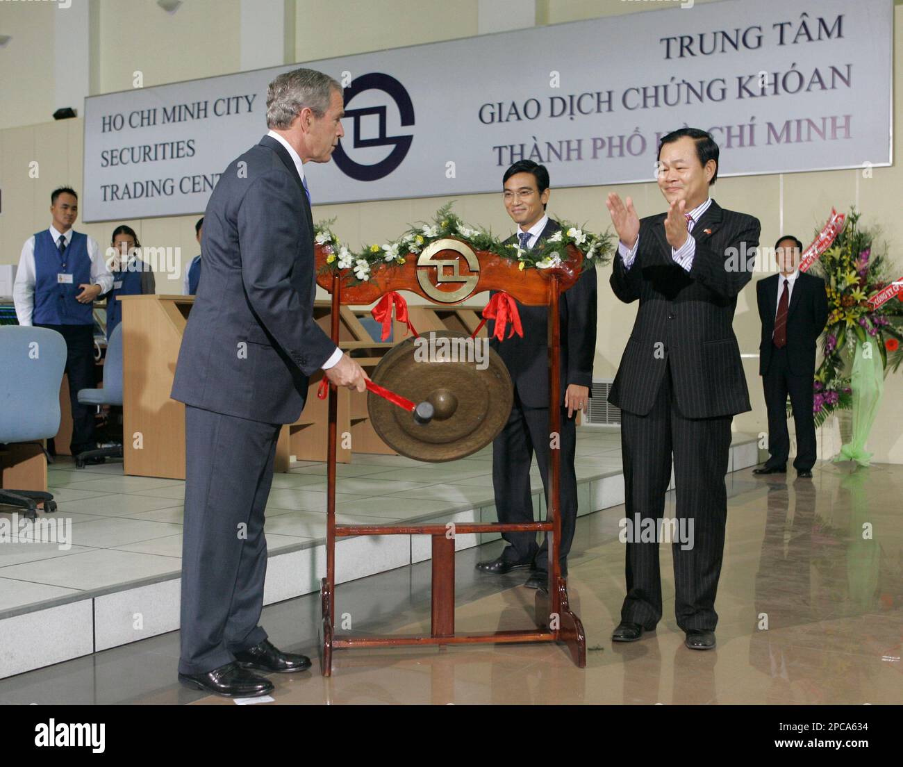 U.S. President George W. Bush, left, sounds the trading floor gong ...