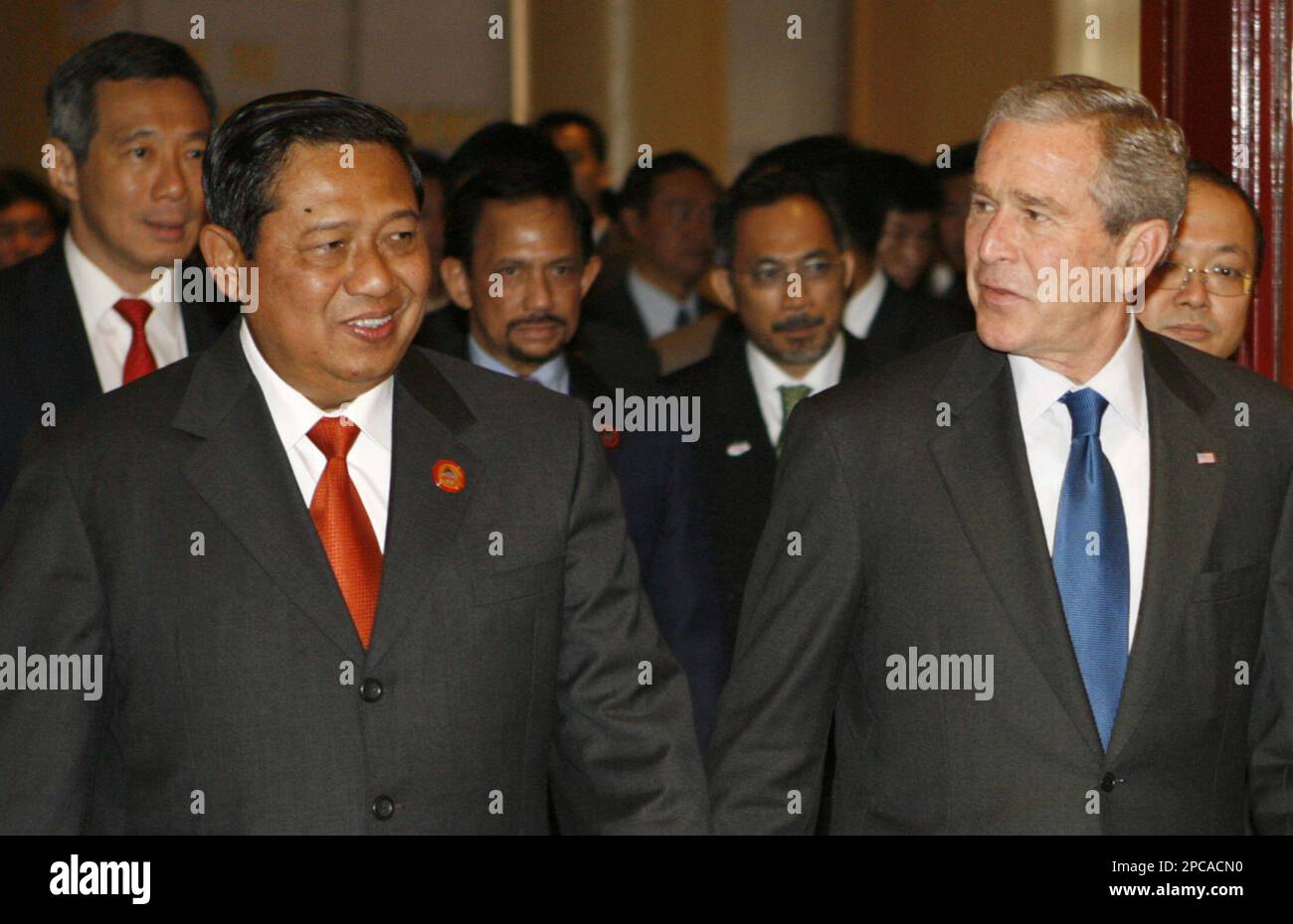 U.S. President George W. Bush, right, walks with Indonesias President ...