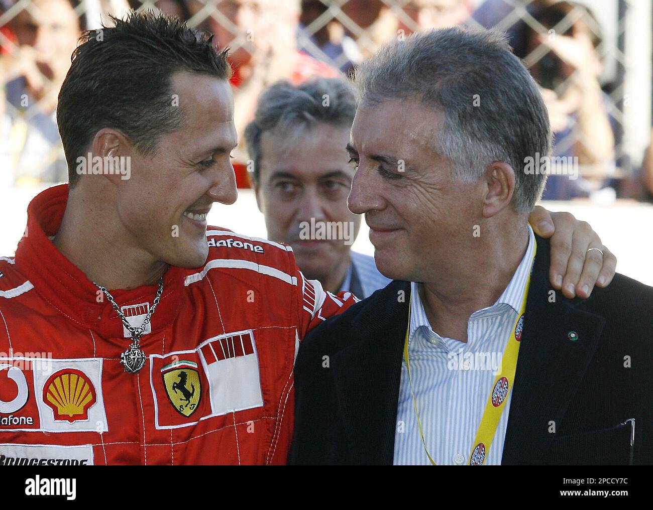 Germany's Michael Schumacher smiles to Piero Lardi Ferrari, right, at ...