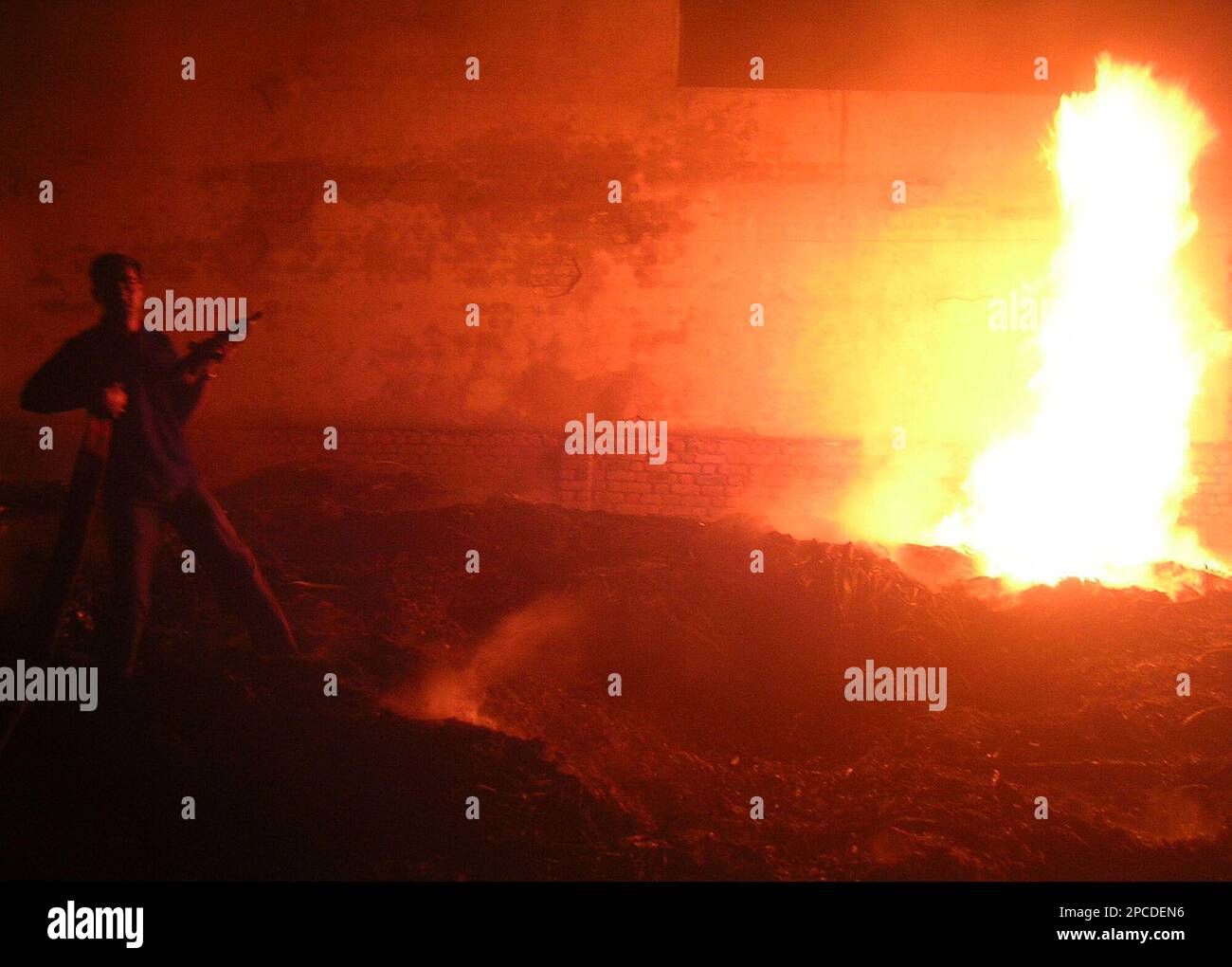 A fireman tries to douse a fire at Reliance Industries Refinery in ...