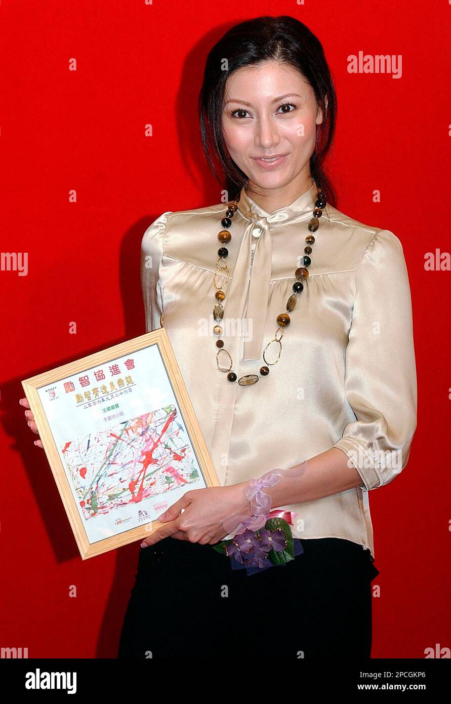 Hong Kong actress Michelle Reis poses for pictures at a charity event ...