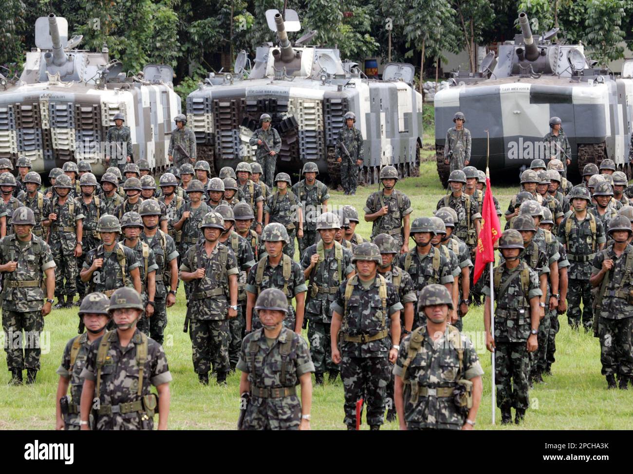 Philippine Marines stand in formation with their Landing Vehicle Truck ...