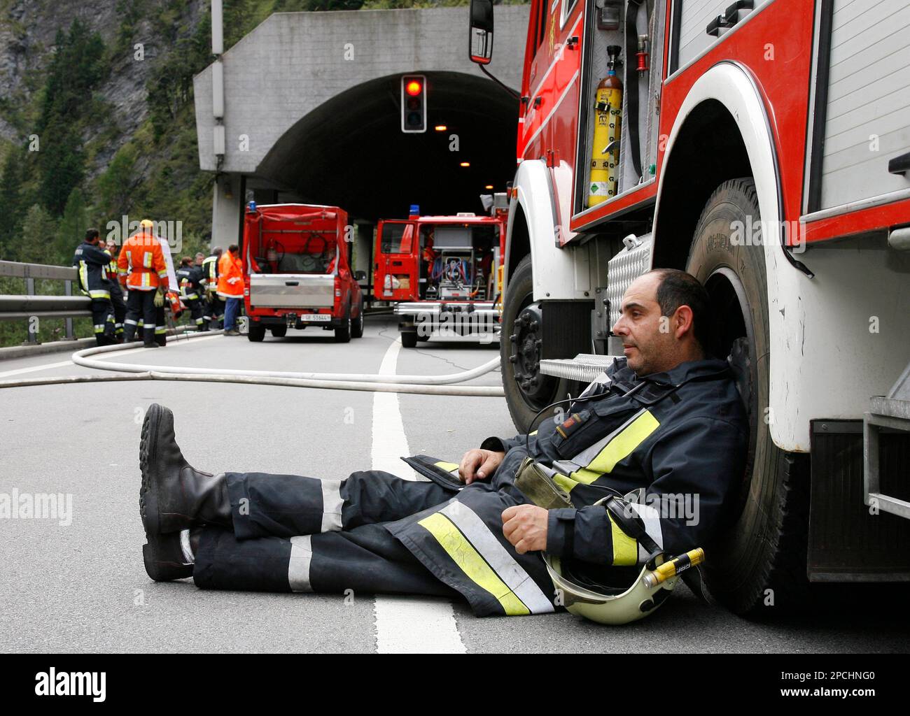 Fire fighters wait in front of the Viamala tunnel on the A13 near ...