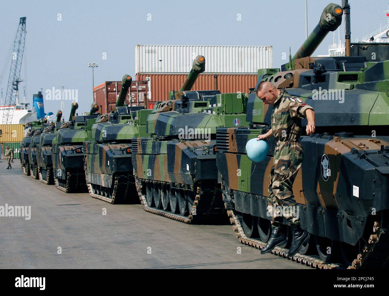 A French U.N. peacekeeper jumps off a Leclerc tank parked in line with ...