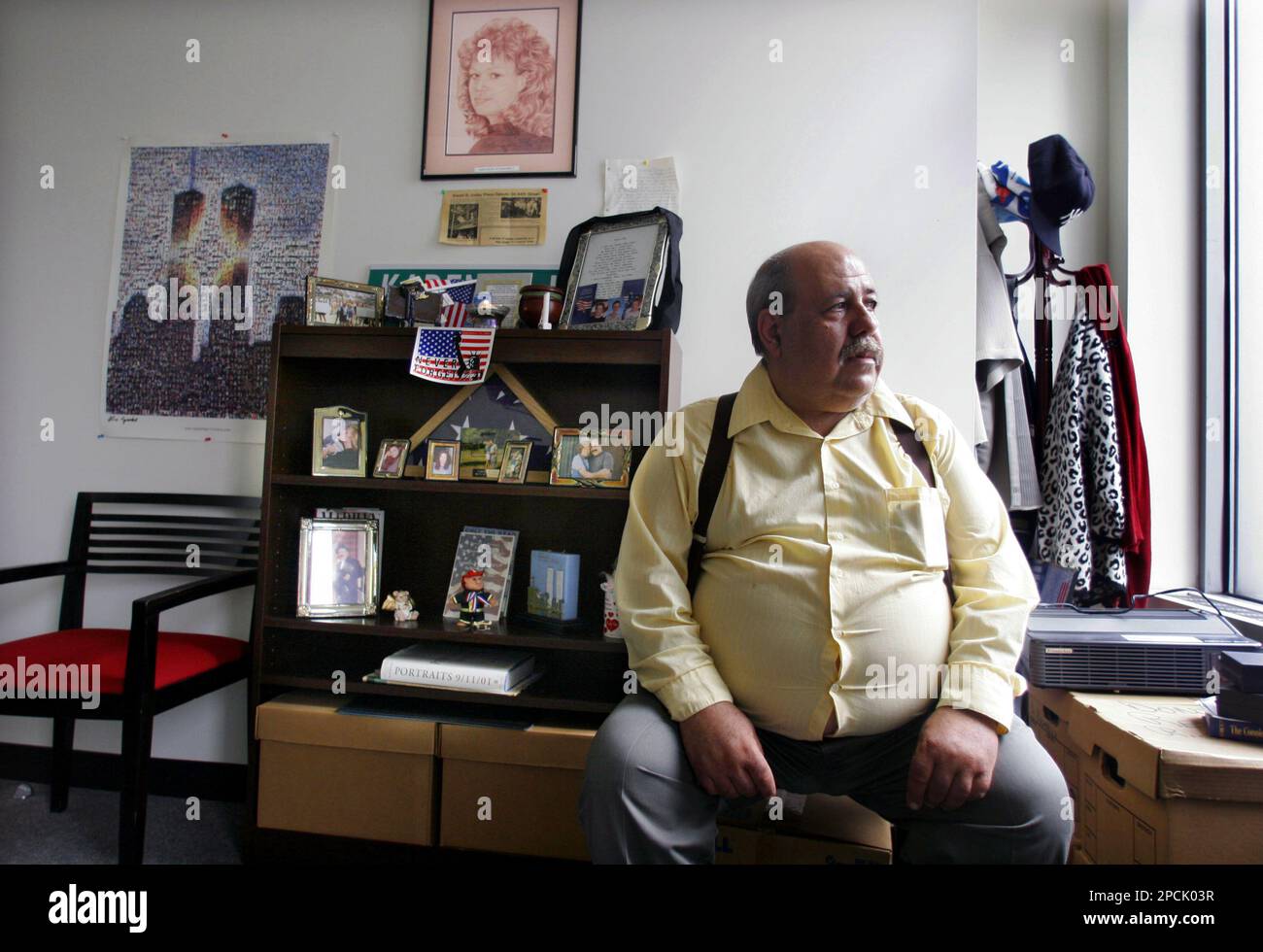 **FILE** Richard Pecorella sits inside his office next to a bookshelf ...