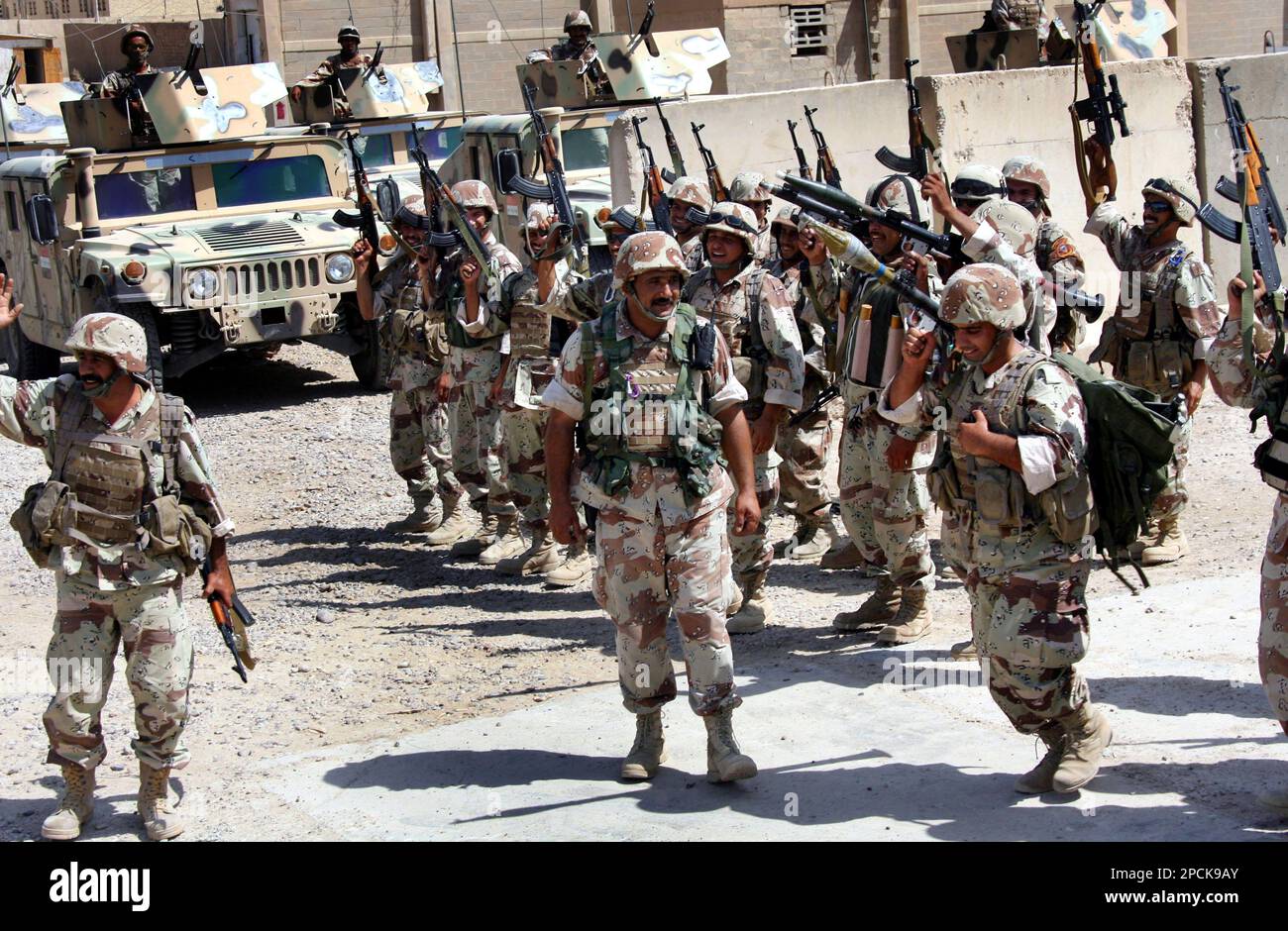 Iraqi army soldiers celebrate after taking over the Abu Ghraib prison ...