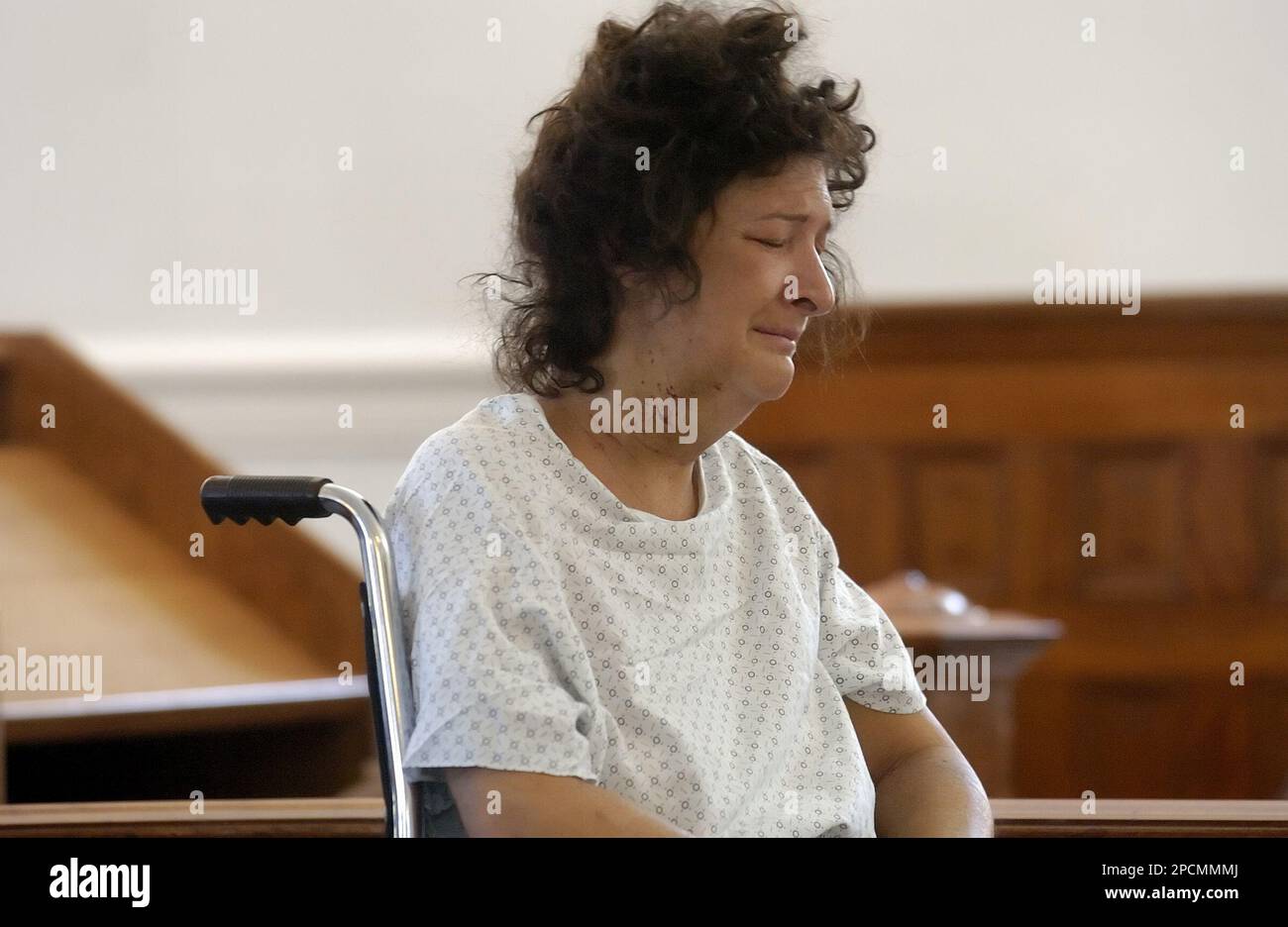 Louise Desnoyers, 48, of Montreal, Canada, cries quietly after being ...