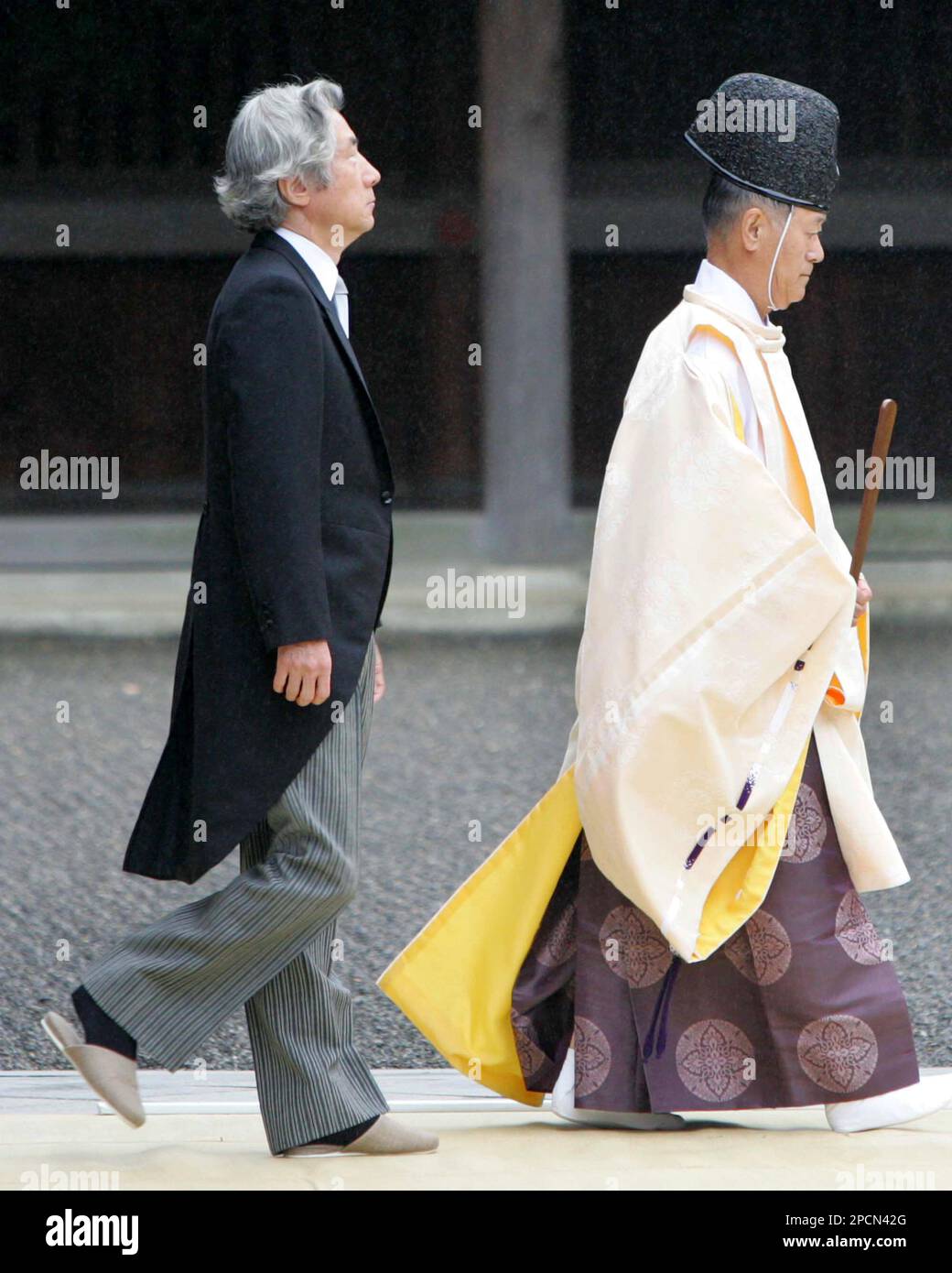Dressed in a black mourning suit, Japanese Prime Minister Junichiro ...