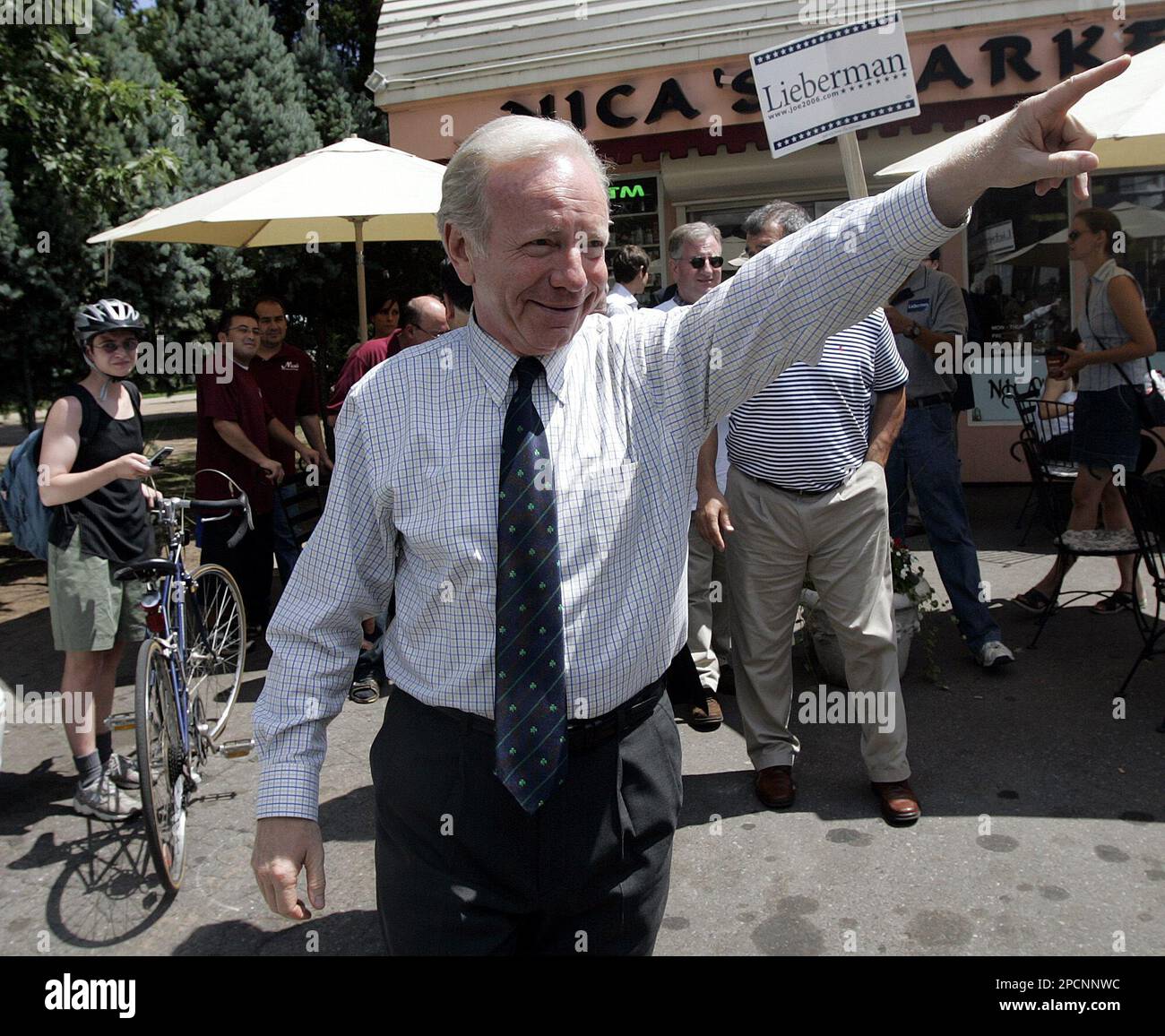 Democratic Sen. Joe Lieberman points toward his bus as he left a New ...