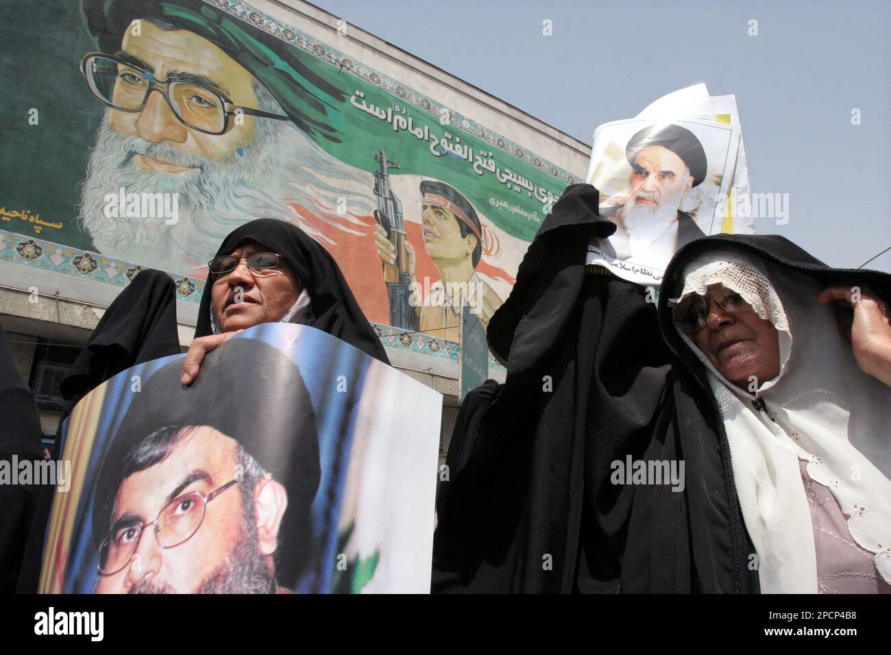 Holding posters of Lebanese Hezbollah party leader Sheik Hassan ...