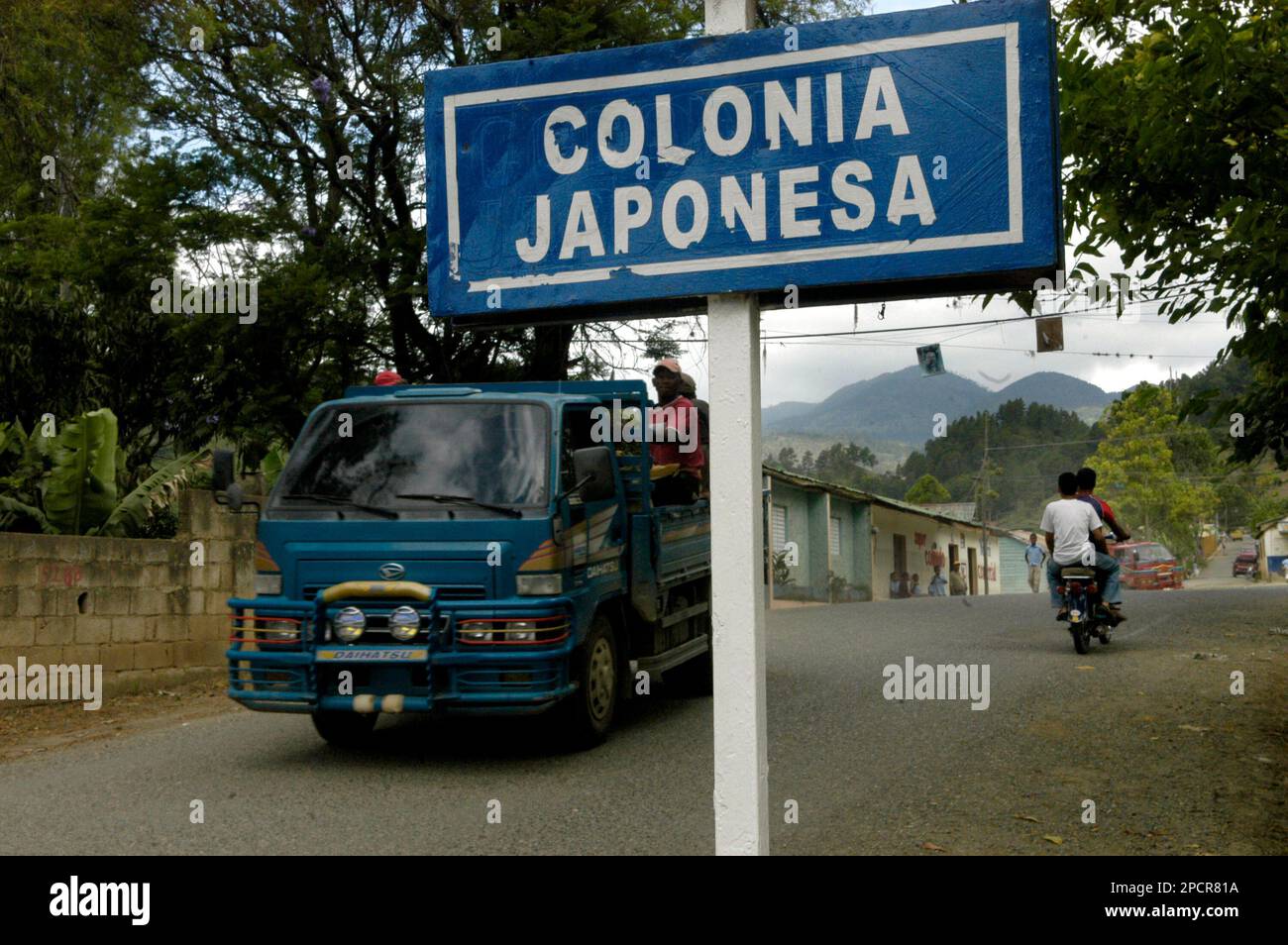 Several persons are seen in the entry of the Japanese colony in ...