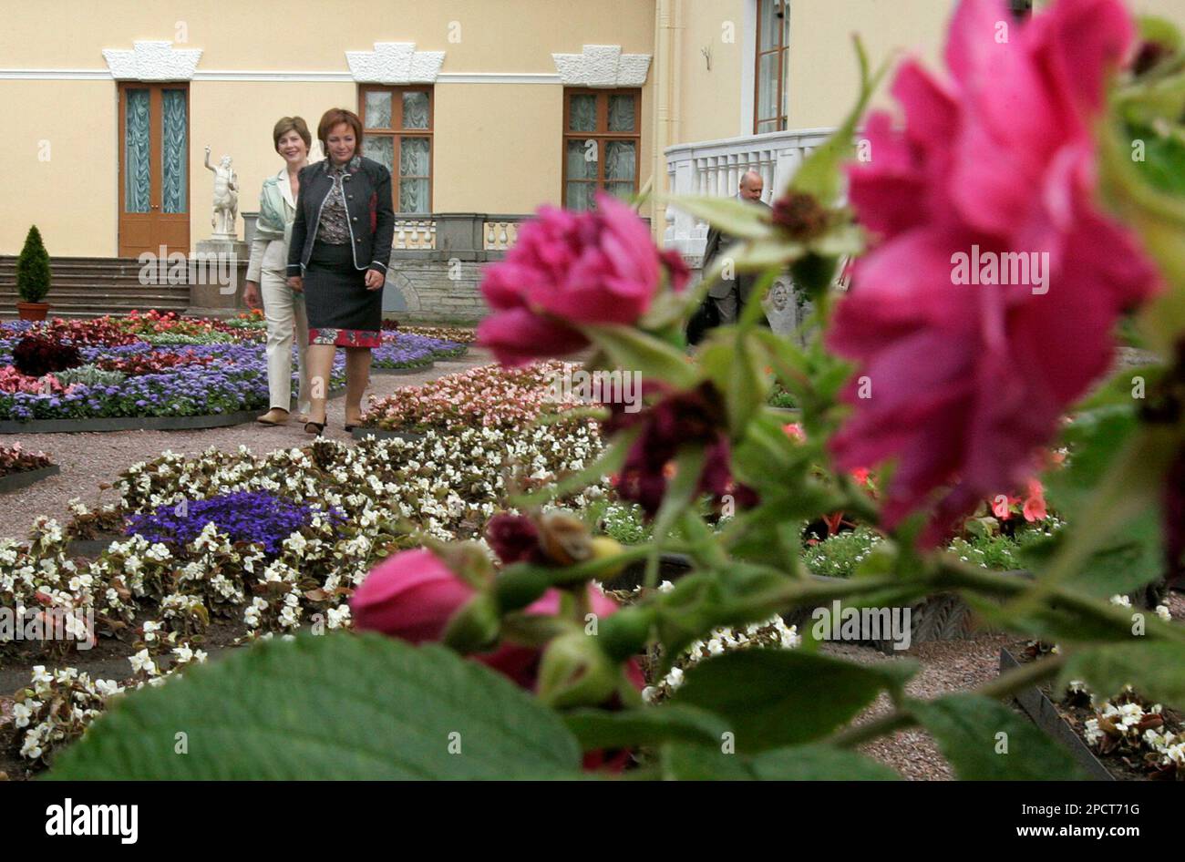U.S. First Lady Laura Bush, left, walks with Russian First Lady ...