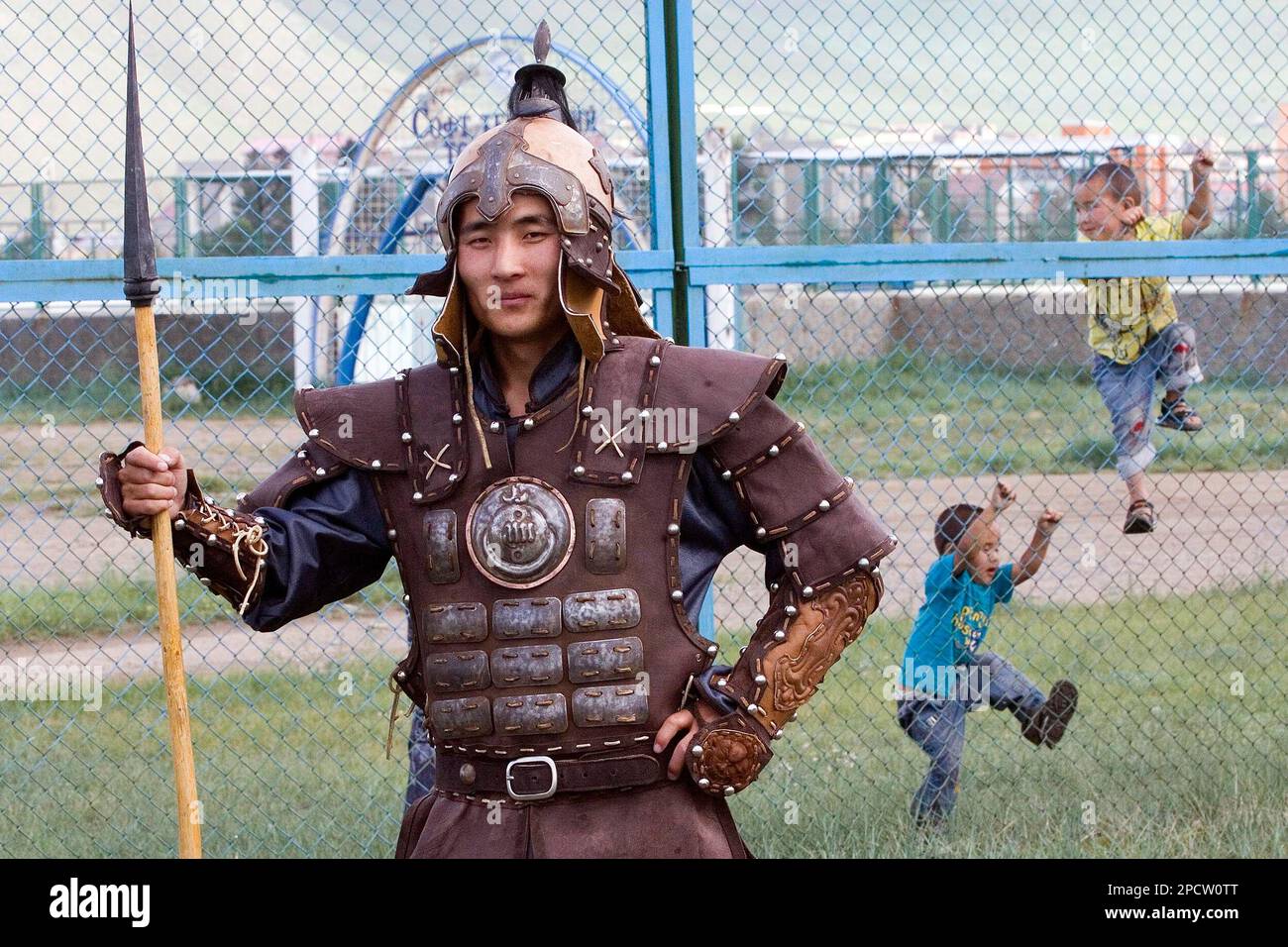 A Mongolian man dressed as a warrior in preparations for the annual ...