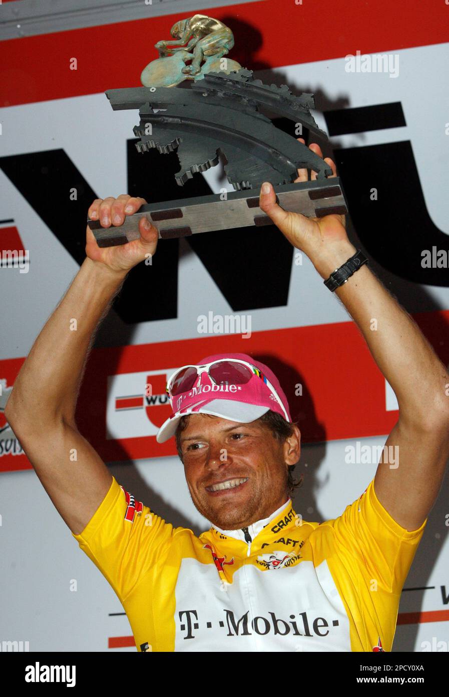 German cyclist and tour winner Jan Ullrich, holds his trophy after the ...