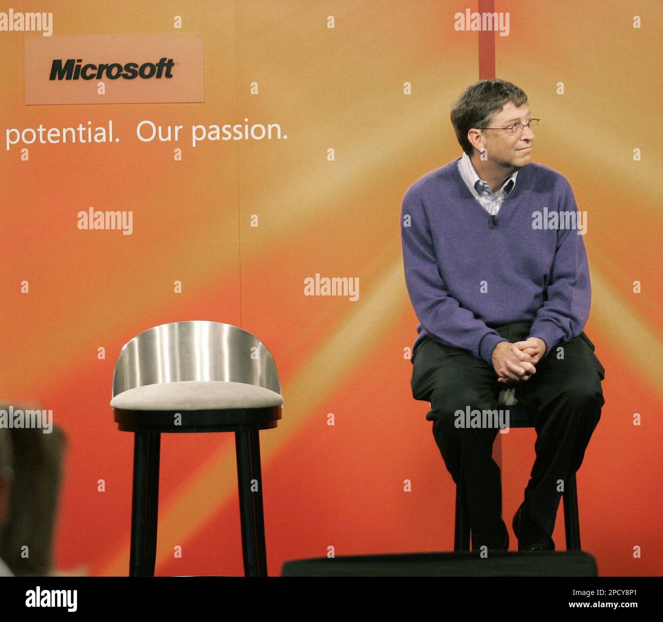 Microsoft Corp. Chairman Bill Gates sits next to an empty chair as ...