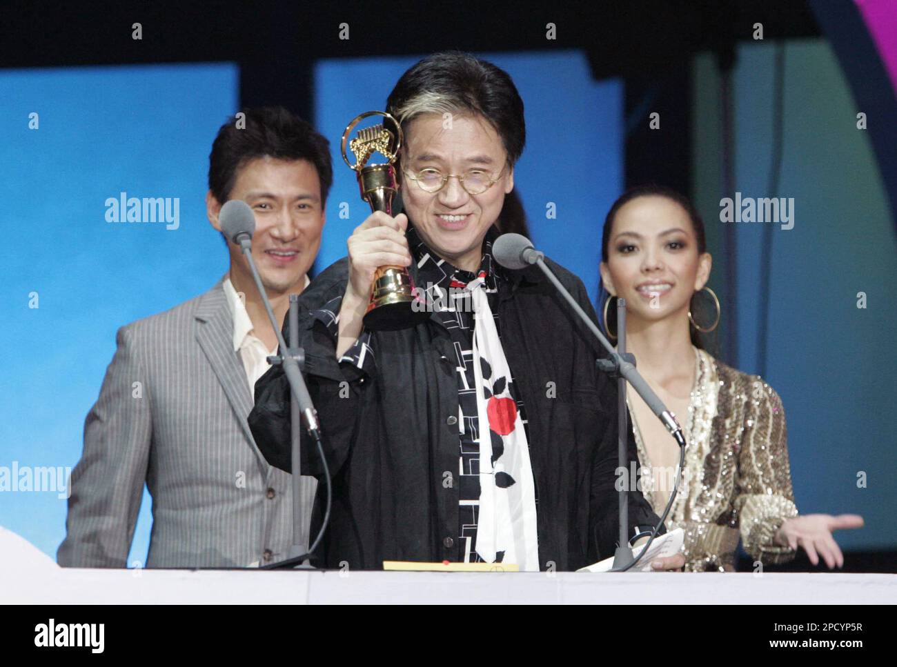 Flanked by Hong Kong pop star Jacky Cheung, left, and Taiwanese singer A-Mei, Tao Da-wei, the ...