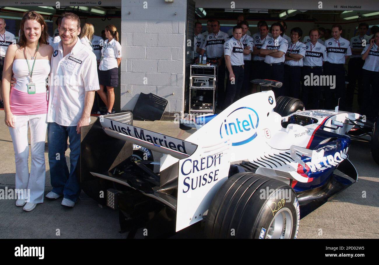 Canadian Formula One driver Jacques Villeneuve stands in the pit lane ...