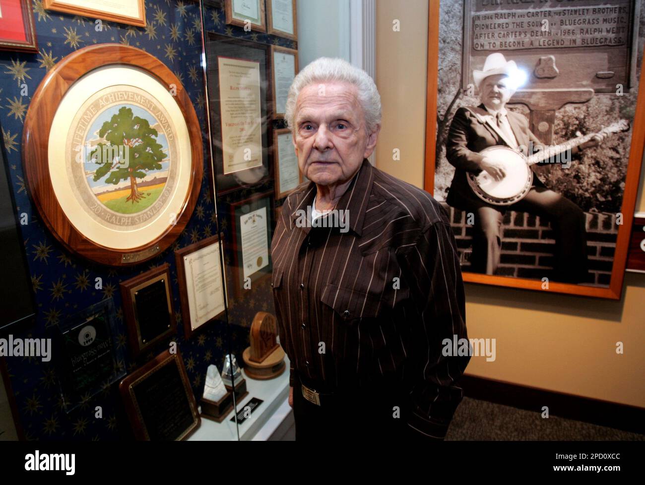 Bluegrass music legend Ralph Stanley looks over display's during an ...