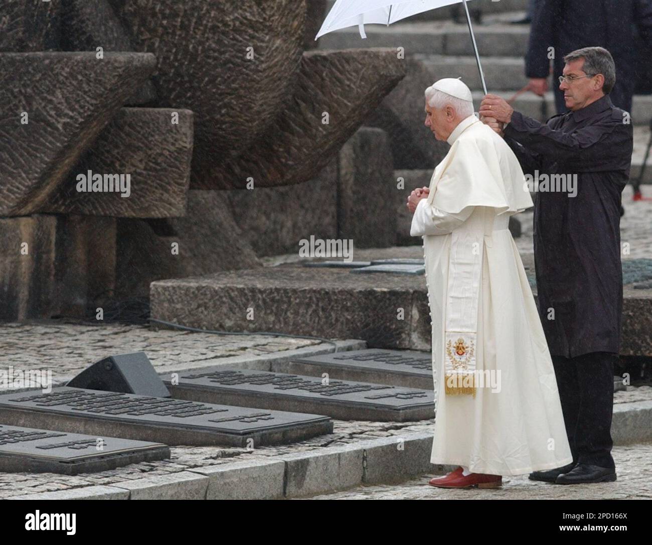 Pope Benedict XVI prays in front of the Memorial at the former Nazi Death Camp Auschwitz ...