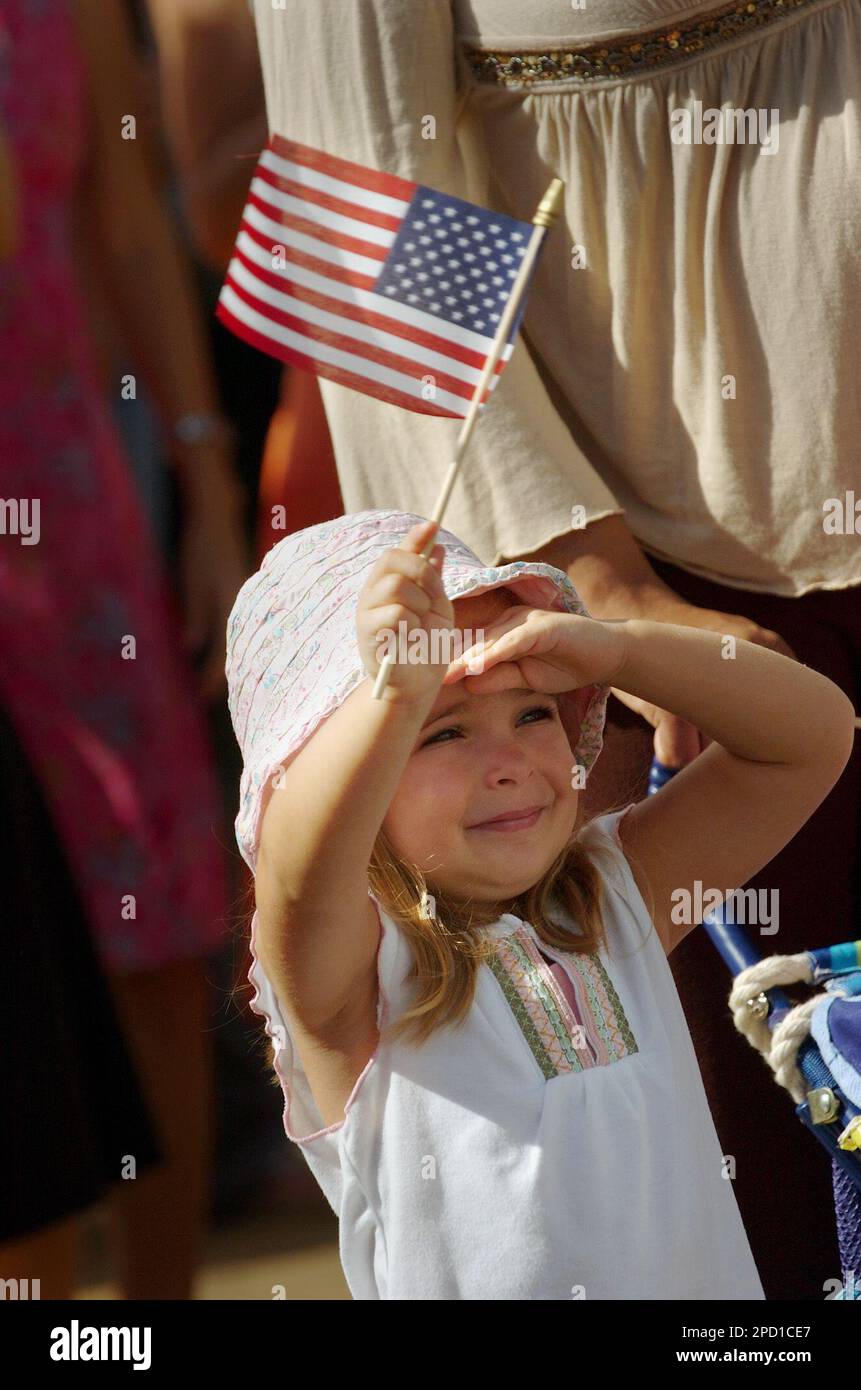 Emma Fox, 3, waves to her father, Lt. Tim Fox, in Pearl Harbor, Hawaii ...