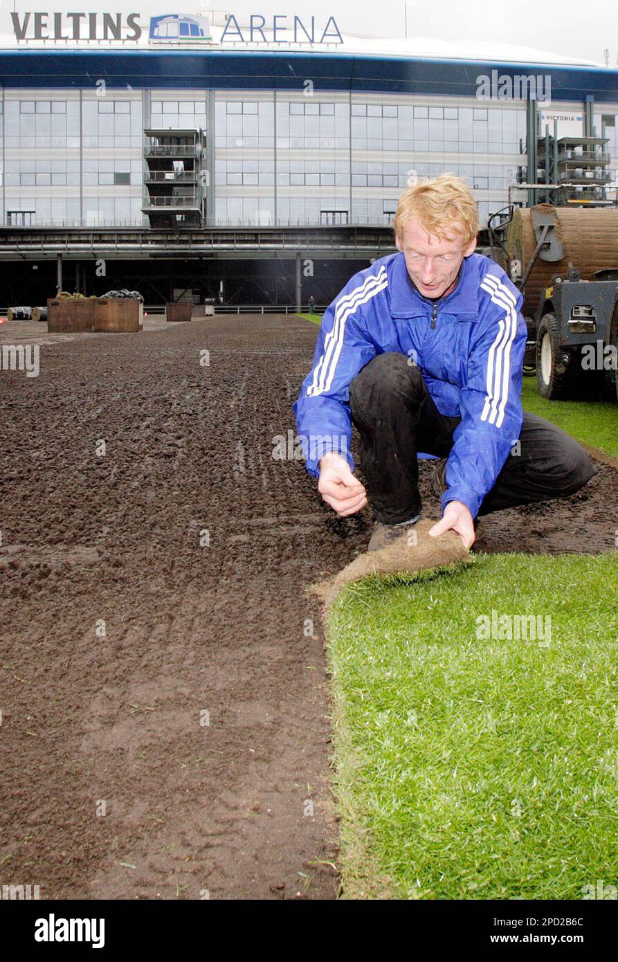 Schalke 04 greenkeeper Thorsten Petri controls the new lawn at the ...