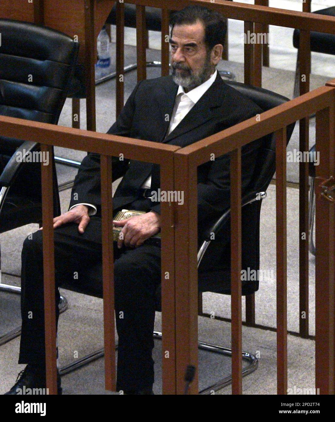 Former Iraqi leader Saddam Hussein attends his trial held in the ...