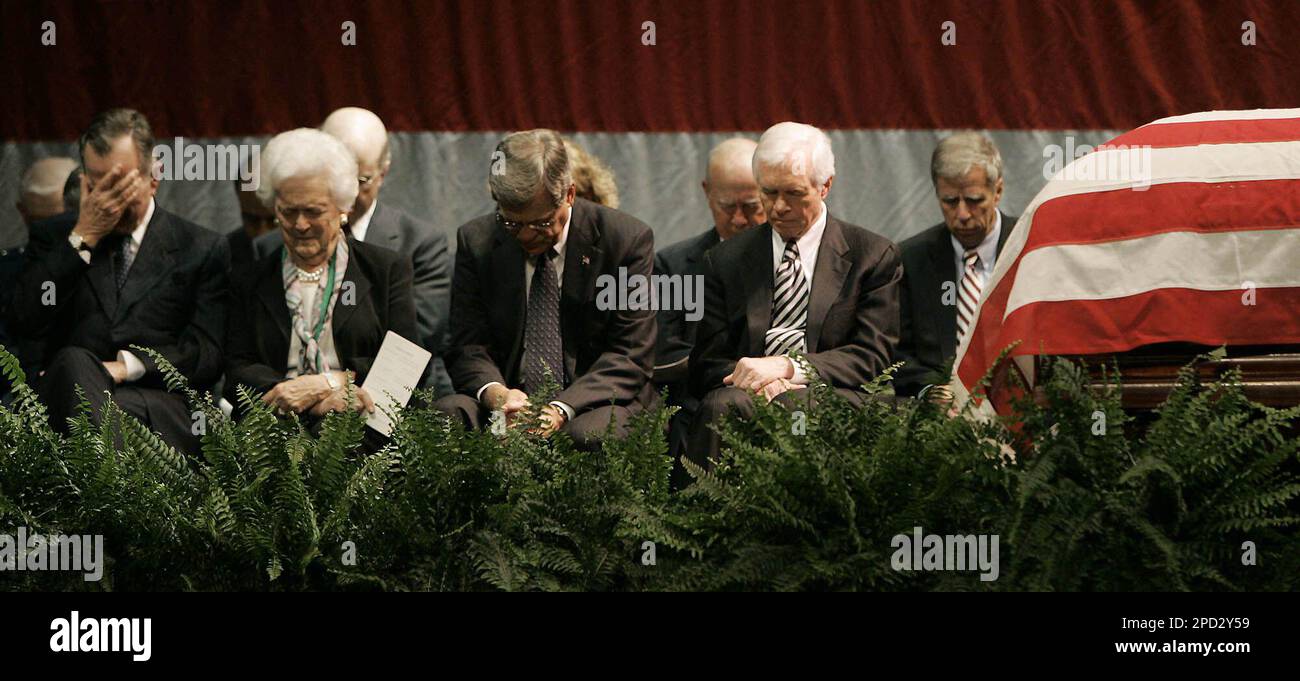 Former President George H.W. Bush, left, expresses his emotion as he ...