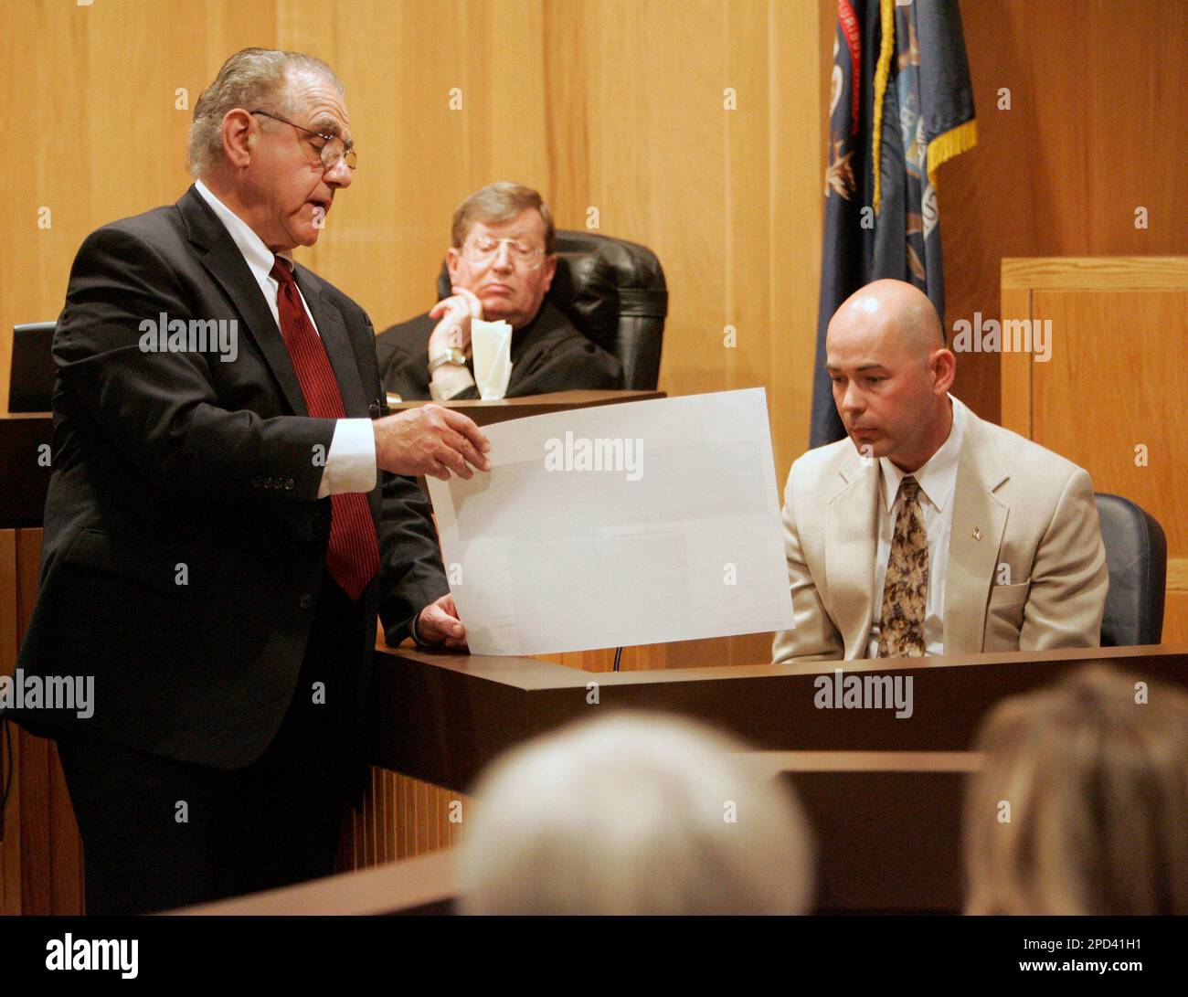 Defense attorney Robert Harrison, left, questions witness Kenneth ...
