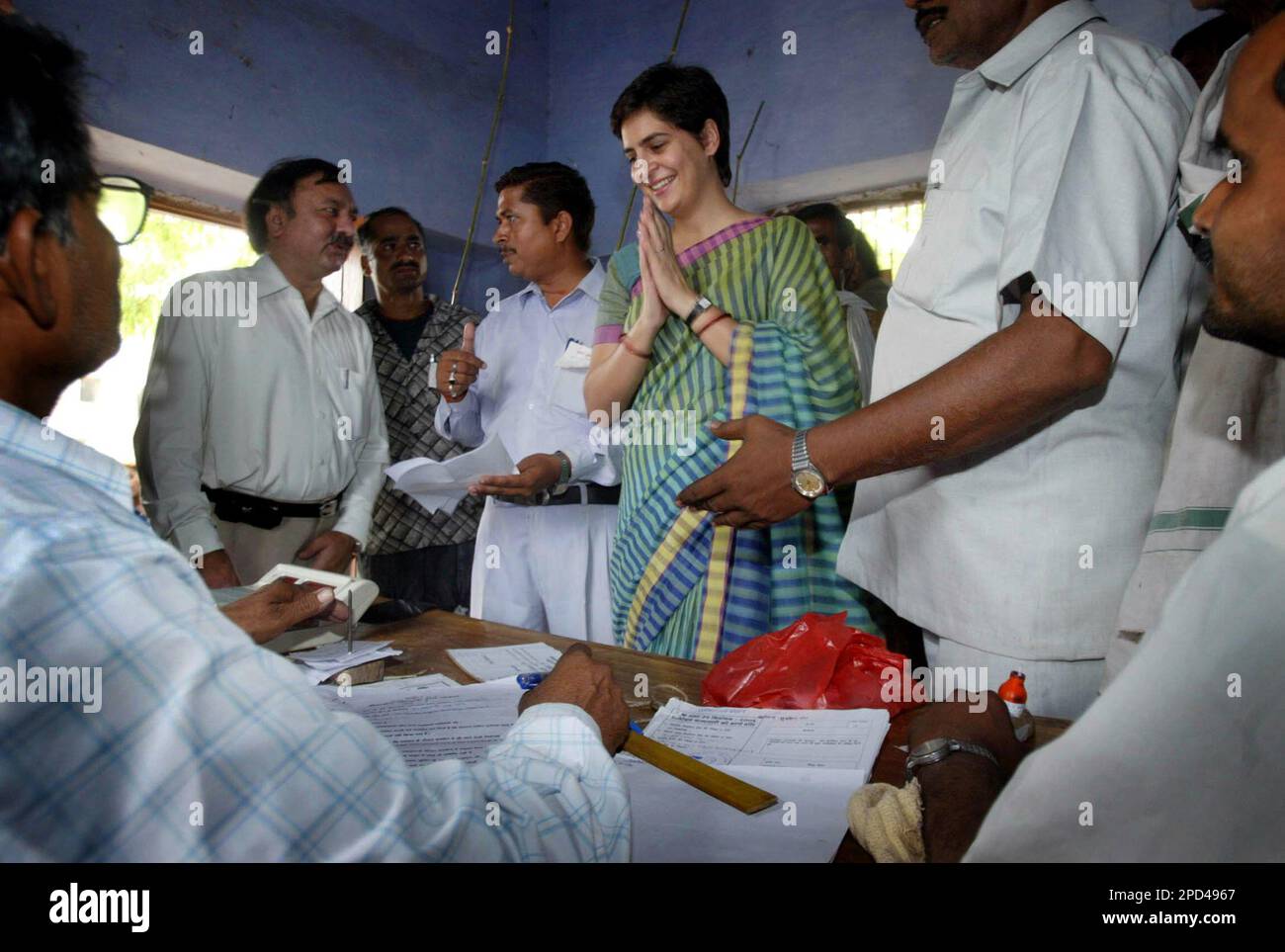 Priyanka Gandhi, center, polling agent and daughter of Congress party ...