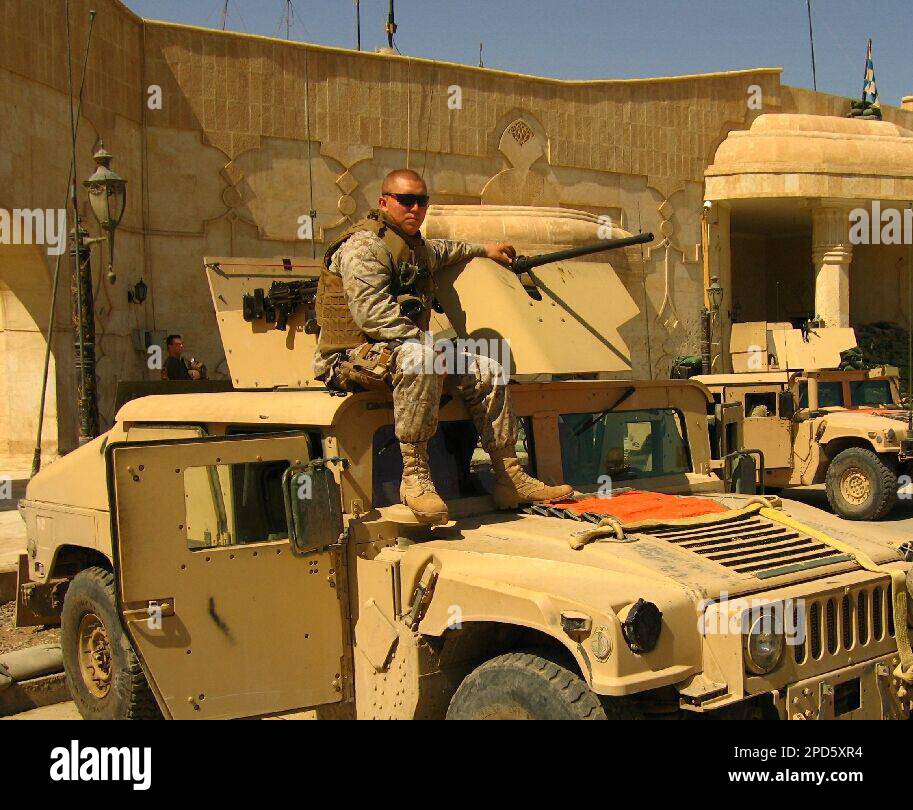 Lance Cpl. Justin Sims, 22, sits on a Humvee at a U.S. Marine base in ...
