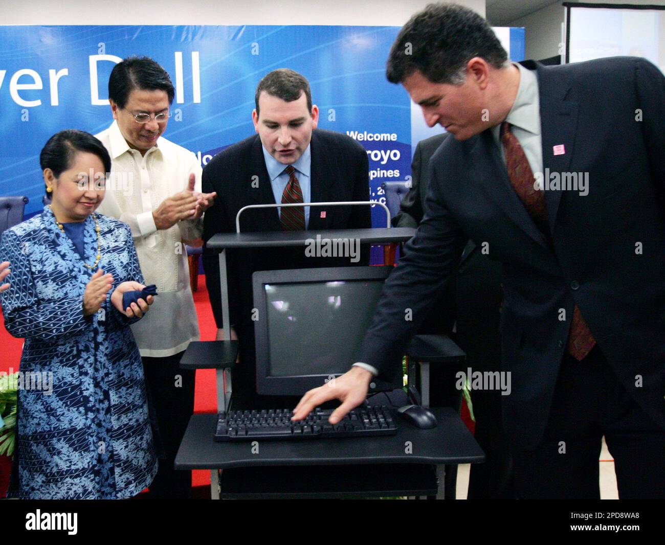 Philippine President Gloria Macapagal Arroyo, left, applauds as Michael ...