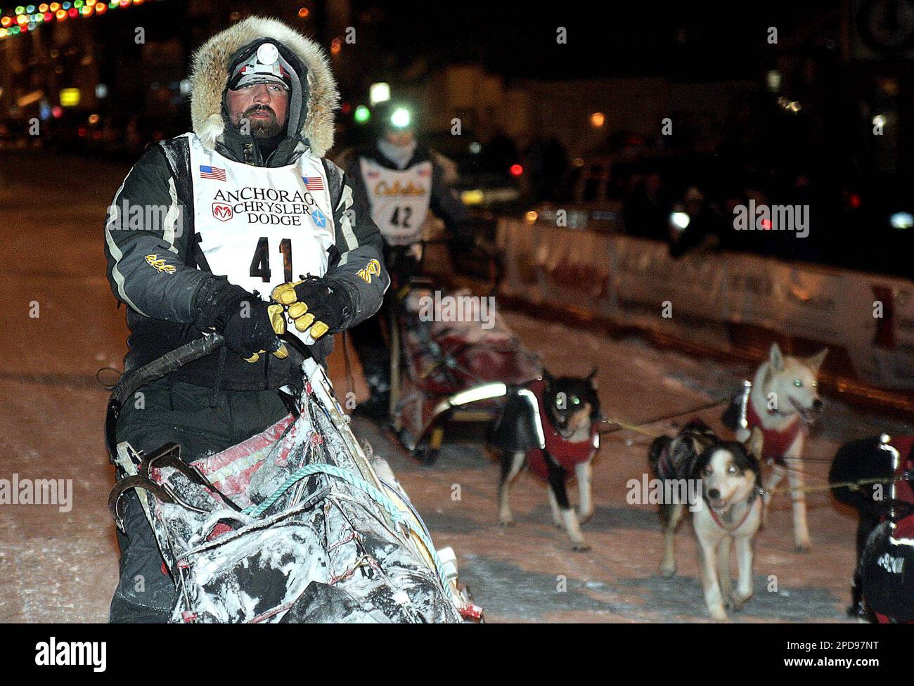 Tim Osmar of Ninilchik, Alaska, left, who drove his dog team in front ...