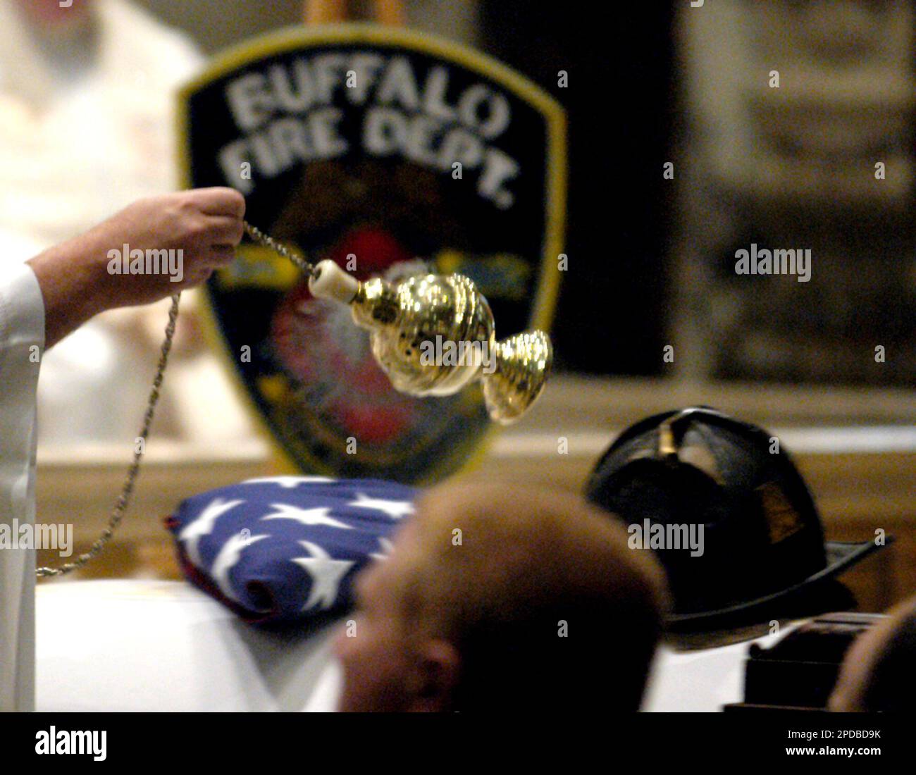 Buffalo Fire Department firefighter Donald Herbert's helmet and a flag ...